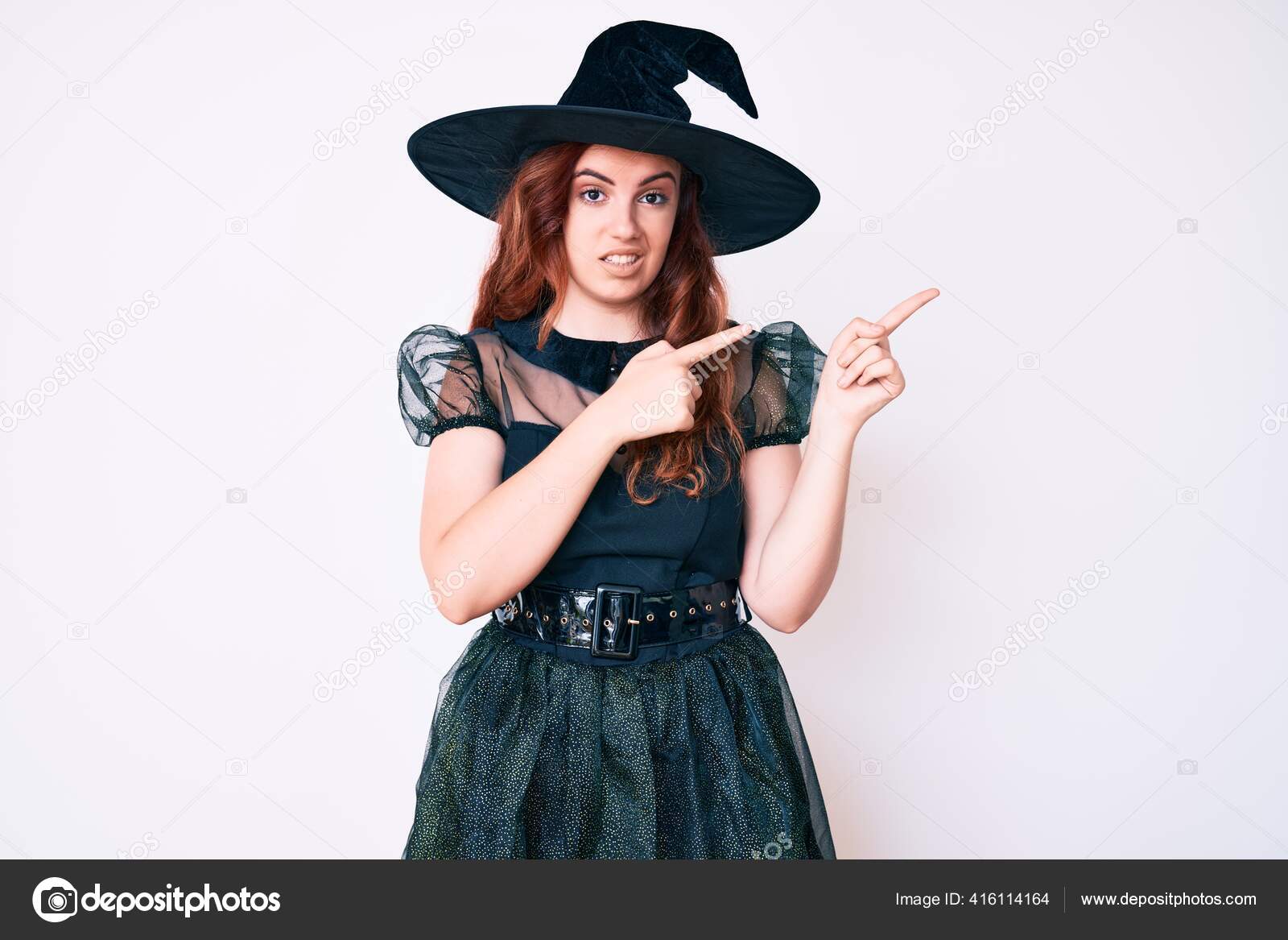 Young Beautiful Woman Wearing Witch Halloween Costume Pointing Aside ...