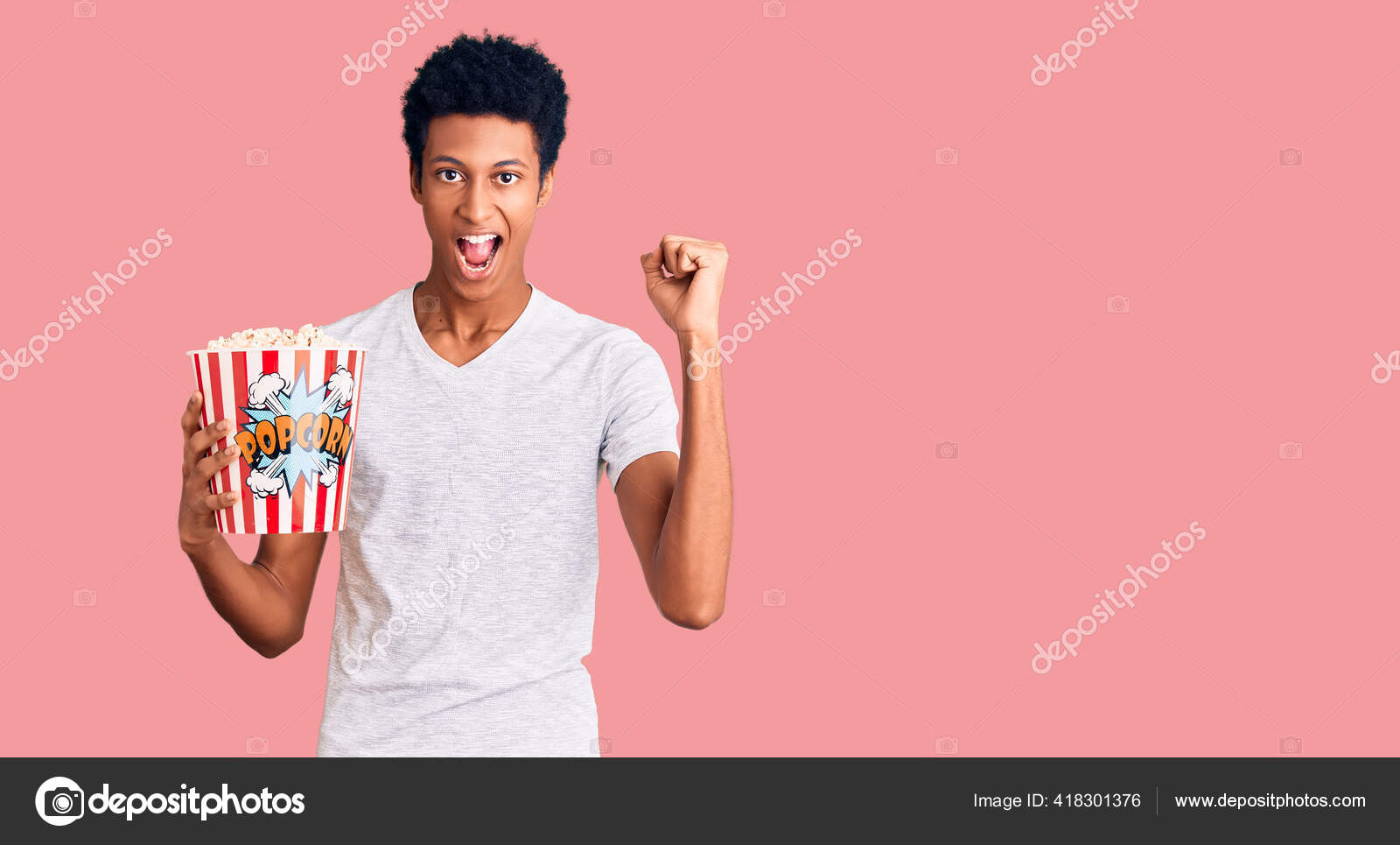 Young African American Man Holding Popcorn Screaming Proud Celebrating Victory — Stock Photo ...