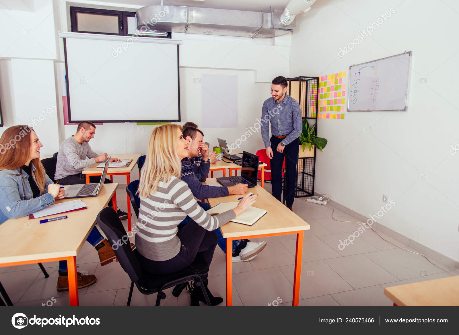 Young Teacher Having Presentation Front Class Stock Photo by ©gorgev ...