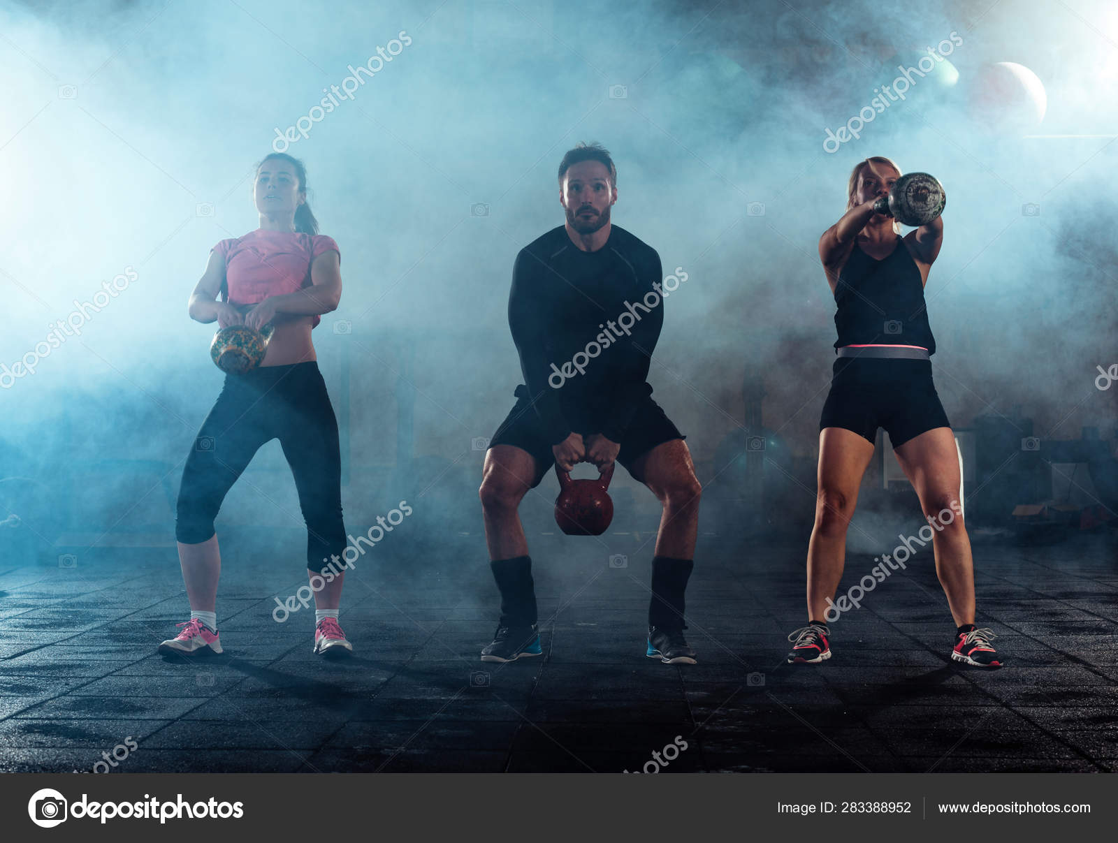 Team workout with kettlebells at fitness gym — Stock Photo © gorgev ...