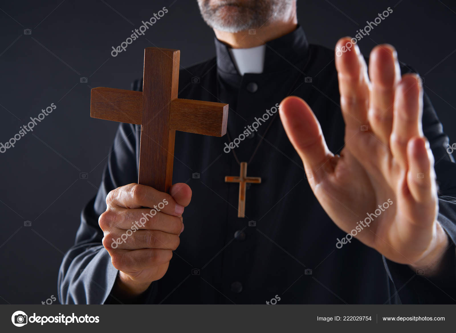 Priest Holding Cross Wood Praying Foreground Stock Photo by ©lunamarina ...