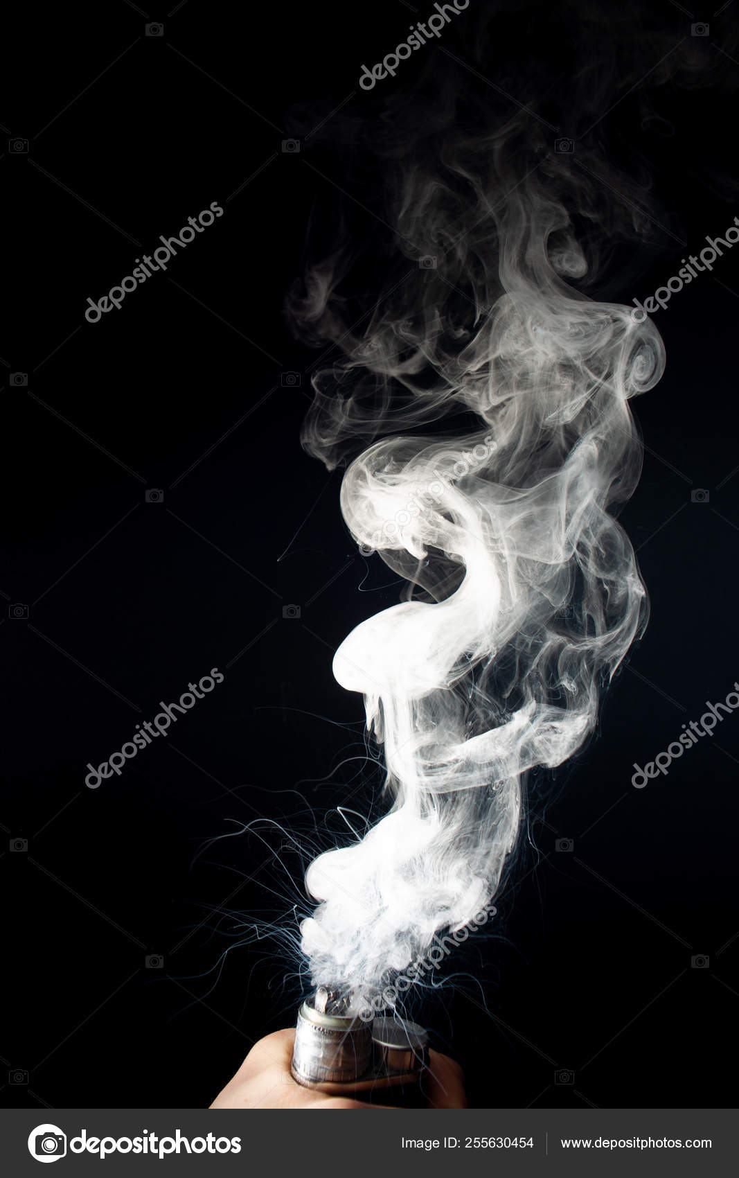 Male hand holds vape without atomiser. Column of vape clouds spl ...