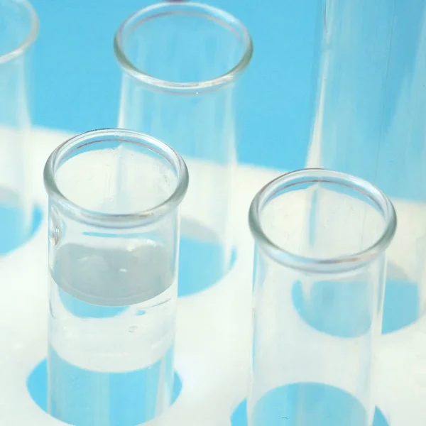 Laboratory vessels on table Stock Photo by ©TunedIn61 85073010