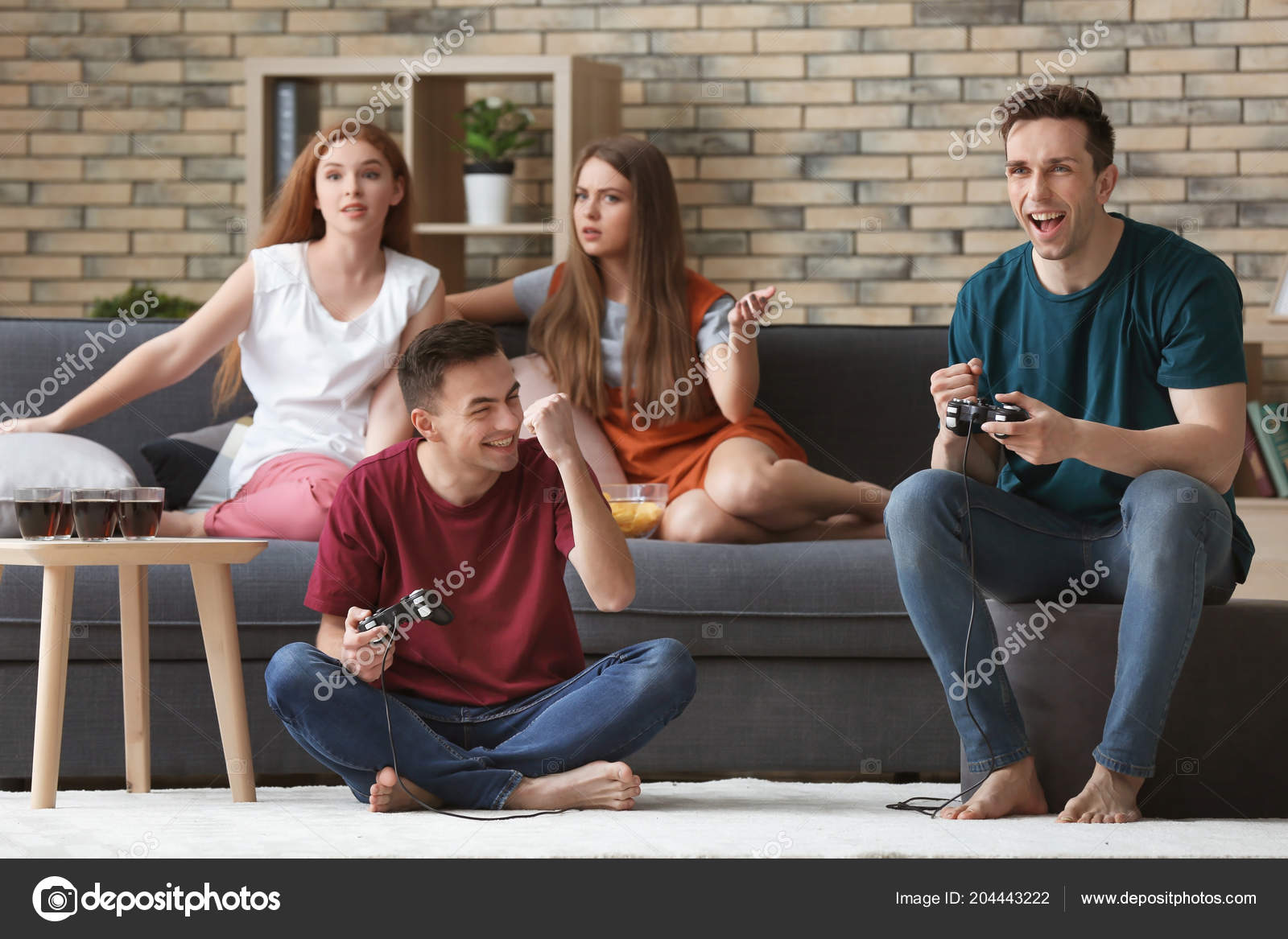 Young People Playing Video Games Home Stock Photo by ©serezniy 204443222
