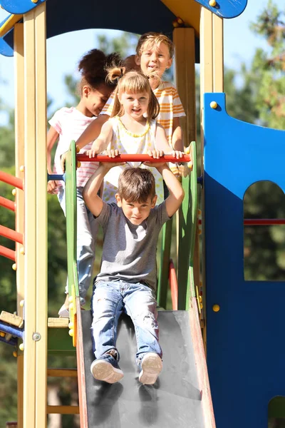 Happy children on slide Stock Photos, Royalty Free Happy children on ...