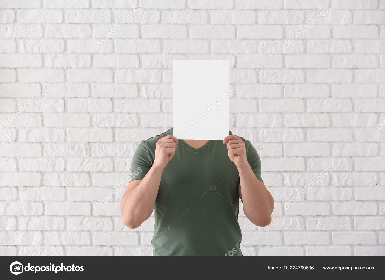 Young Man Hiding Face Blank Sheet Paper White Brick Wall Stock Photo by ...