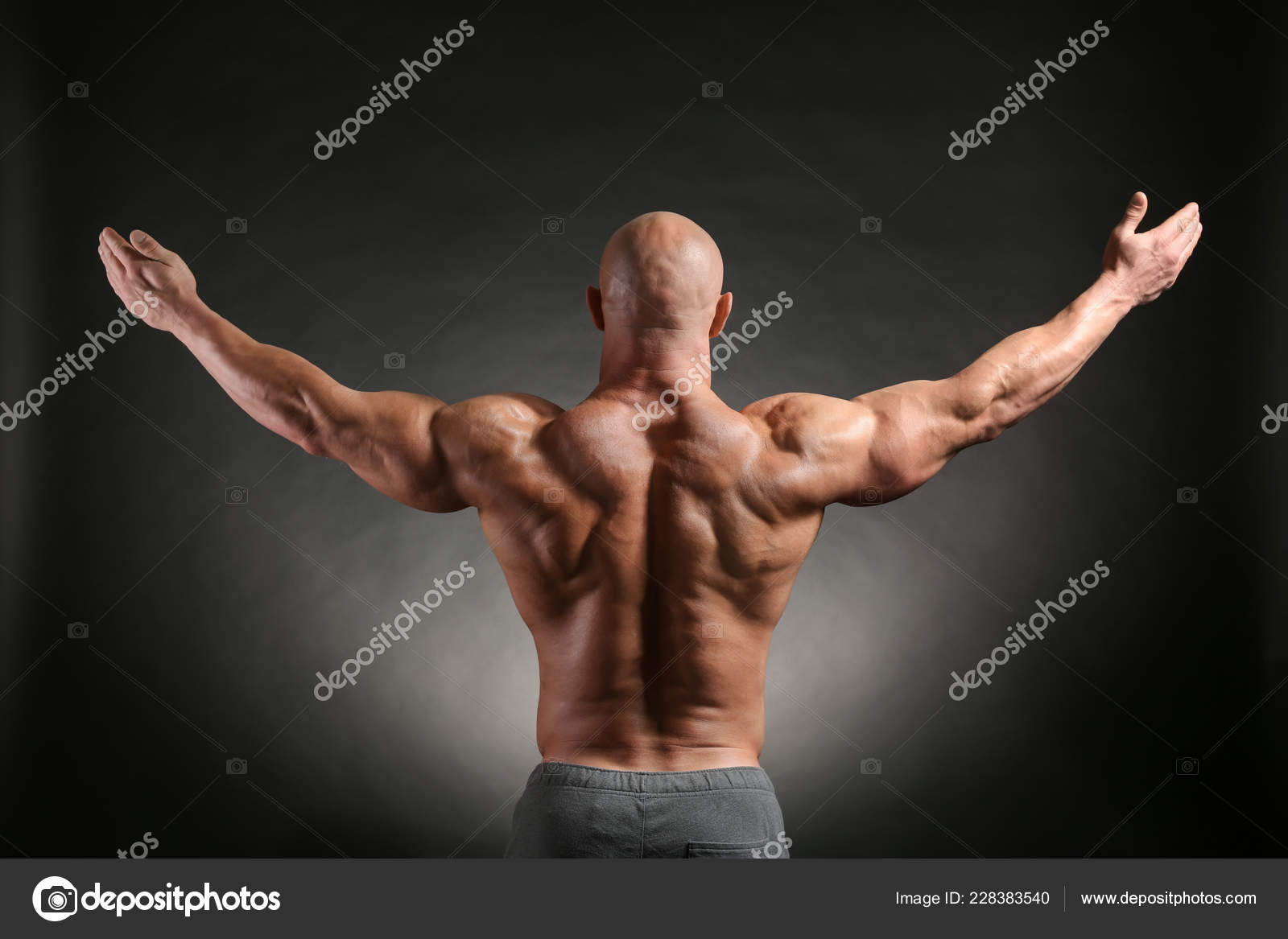 Muscular Bodybuilder Dark Background Stock Photo by ©serezniy 228383540