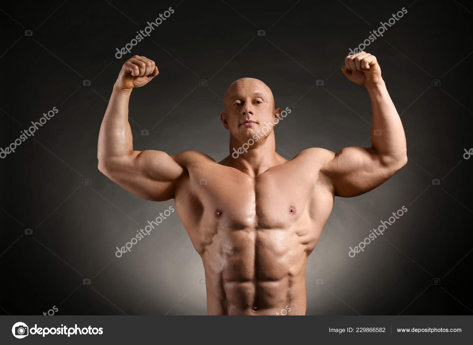 Muscular Bodybuilder Dark Background Stock Photo by ©serezniy 229866582