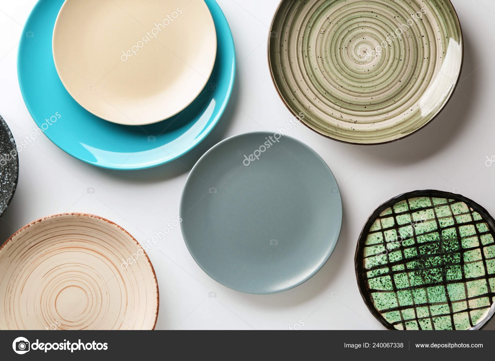 Set Stylish Plates Light Background Stock Photo by ©serezniy 240067338