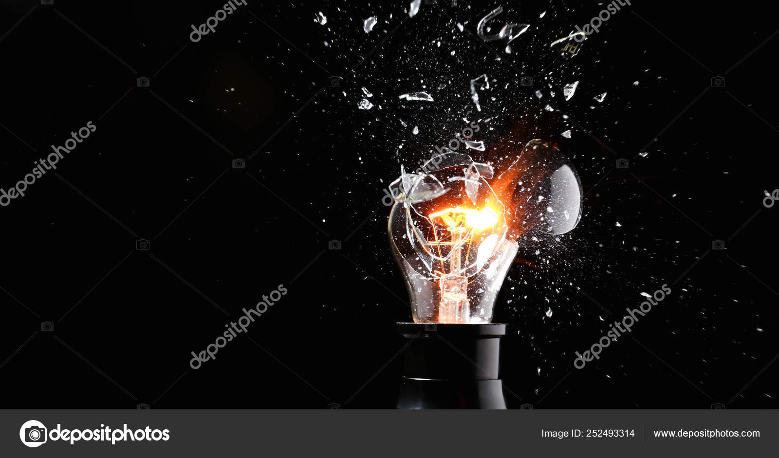 Breaking of light bulb on dark background — Stock Photo © serezniy ...