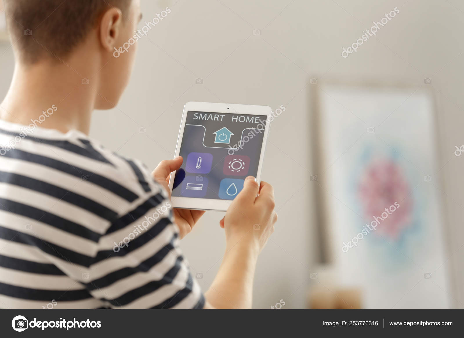Teenage boy using application of smart home automation Stock Photo by ...