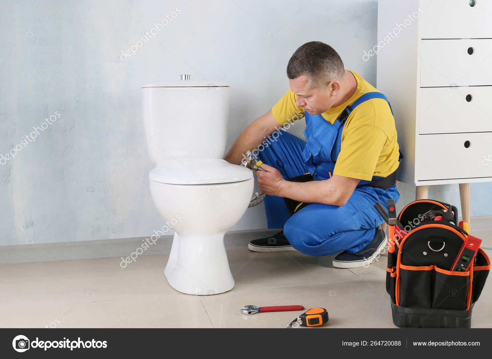 Plumber working in restroom — Stock Photo © serezniy #264720088