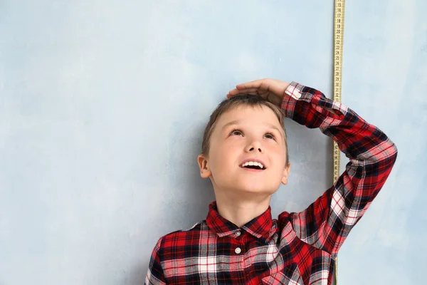 Little Boy Measuring Height Color Wall Stock Photo by ©serezniy 484384566