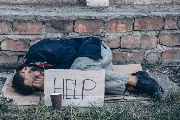 Poor homeless man begging for help outdoors - Stock Image - Everypixel