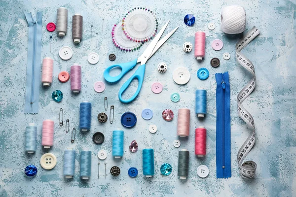 Set of sewing threads and accessories on color background Stock Photo ...