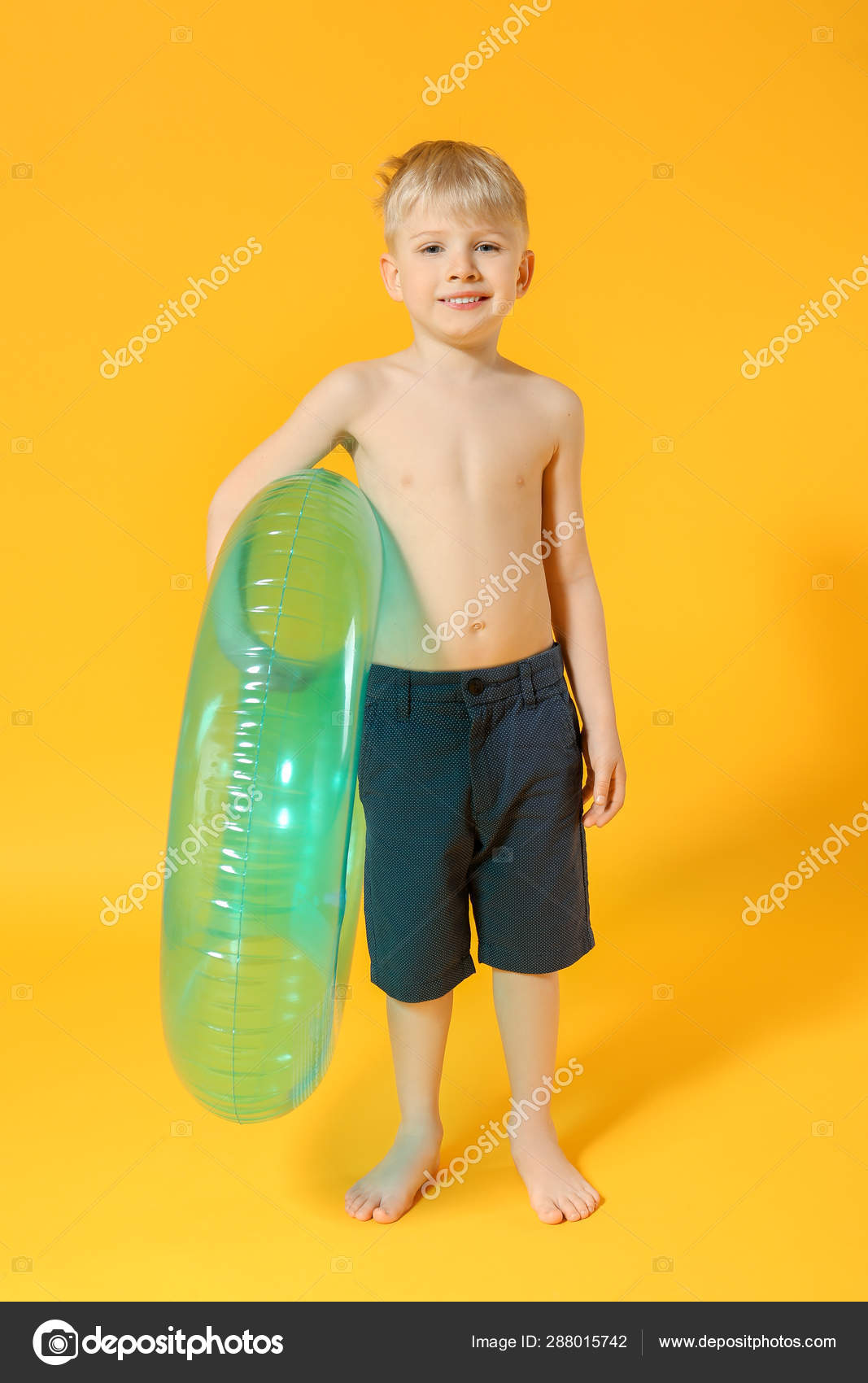 Cute little boy with inflatable ring on color background Stock Photo by ...