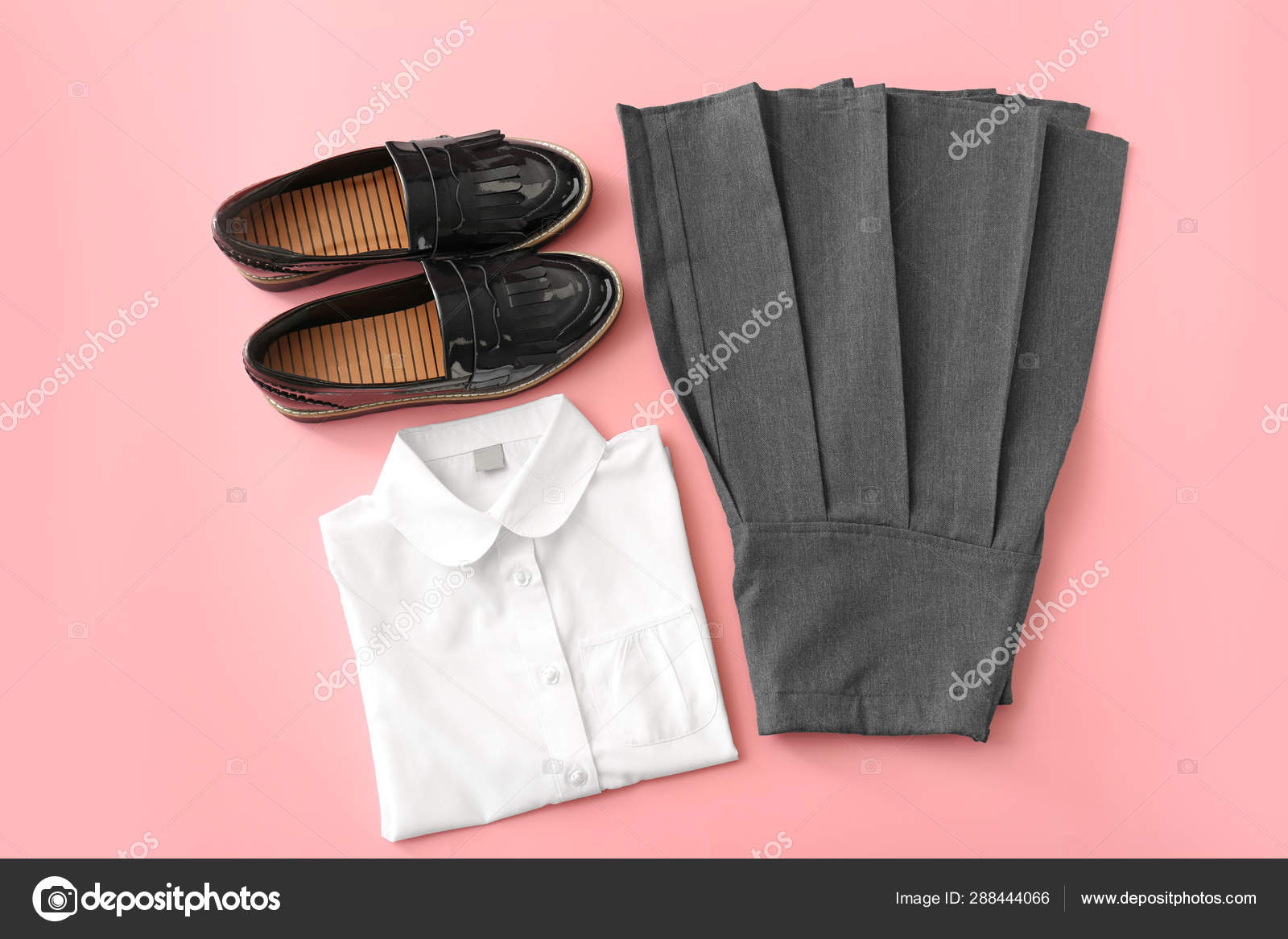 School uniform on color background Stock Photo by ©serezniy 288444066