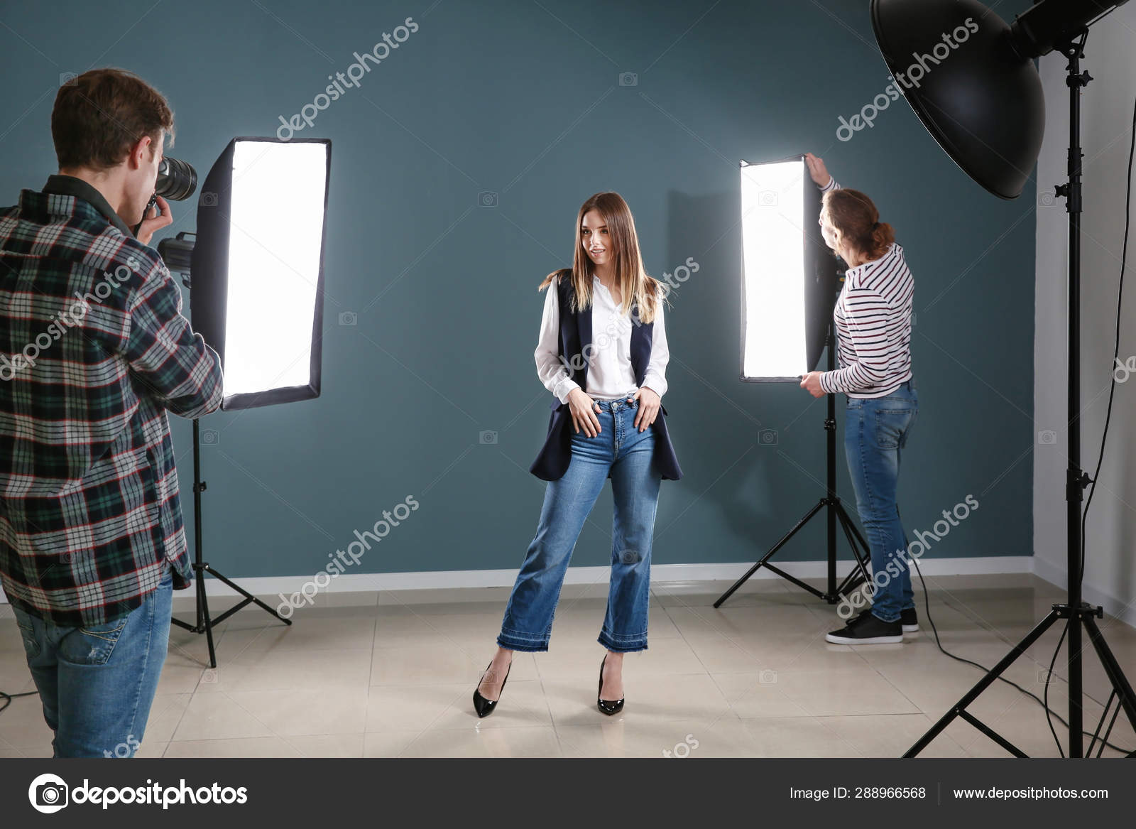 Professional photographer working with model in studio — Stock Photo ...