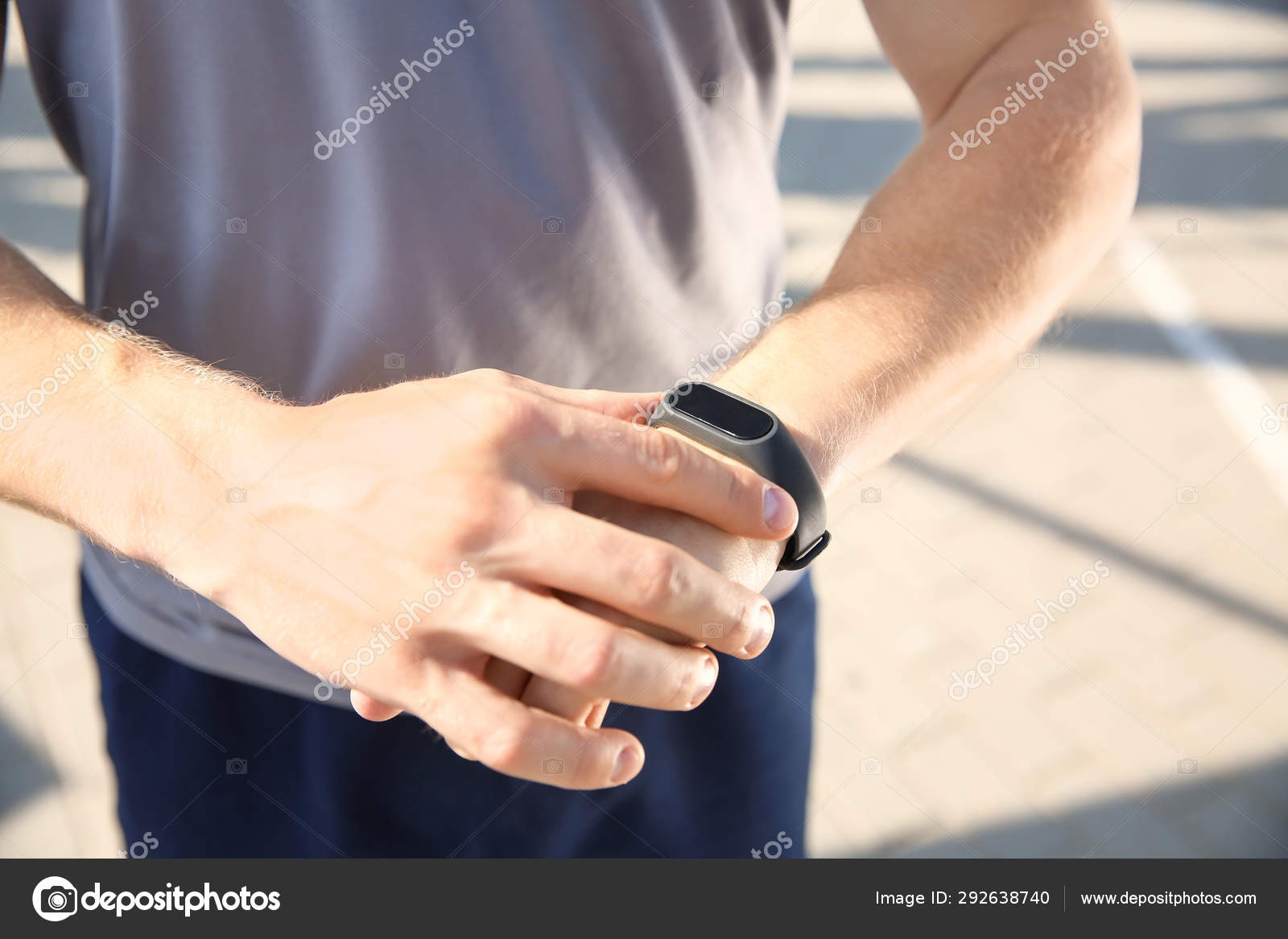 Sporty young man checking his pulse outdoors, closeup — Stock Photo ...
