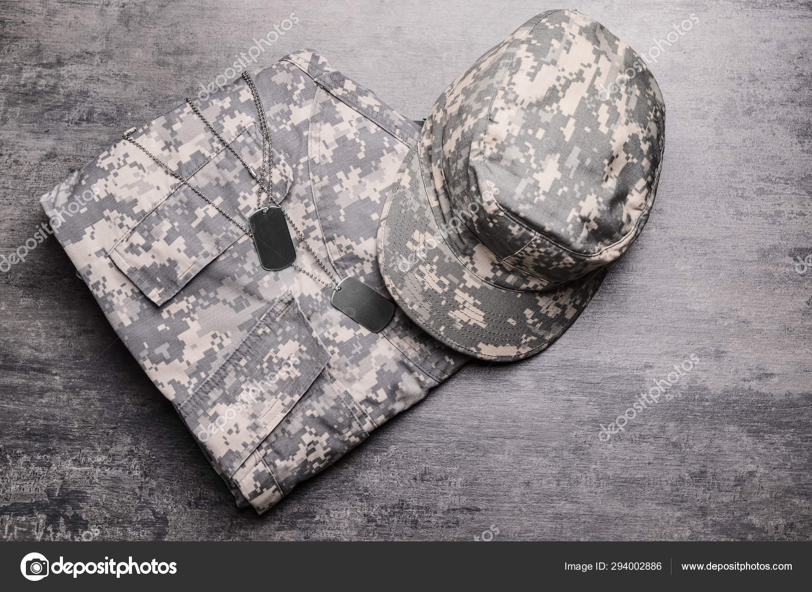 Military uniform on grey background — Stock Photo © serezniy #294002886