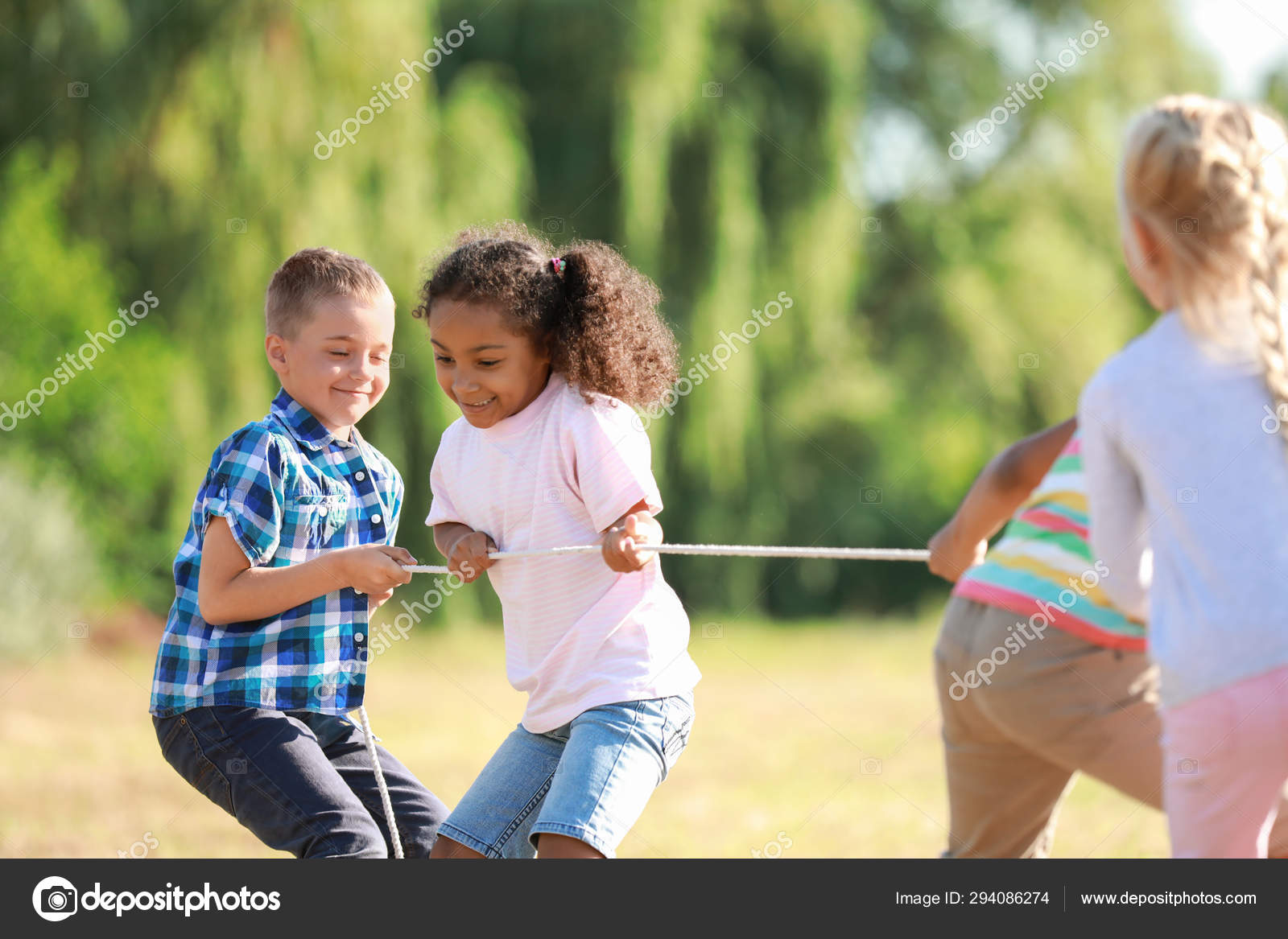 Group of little children pulling rope in park Stock Photo by ©serezniy ...