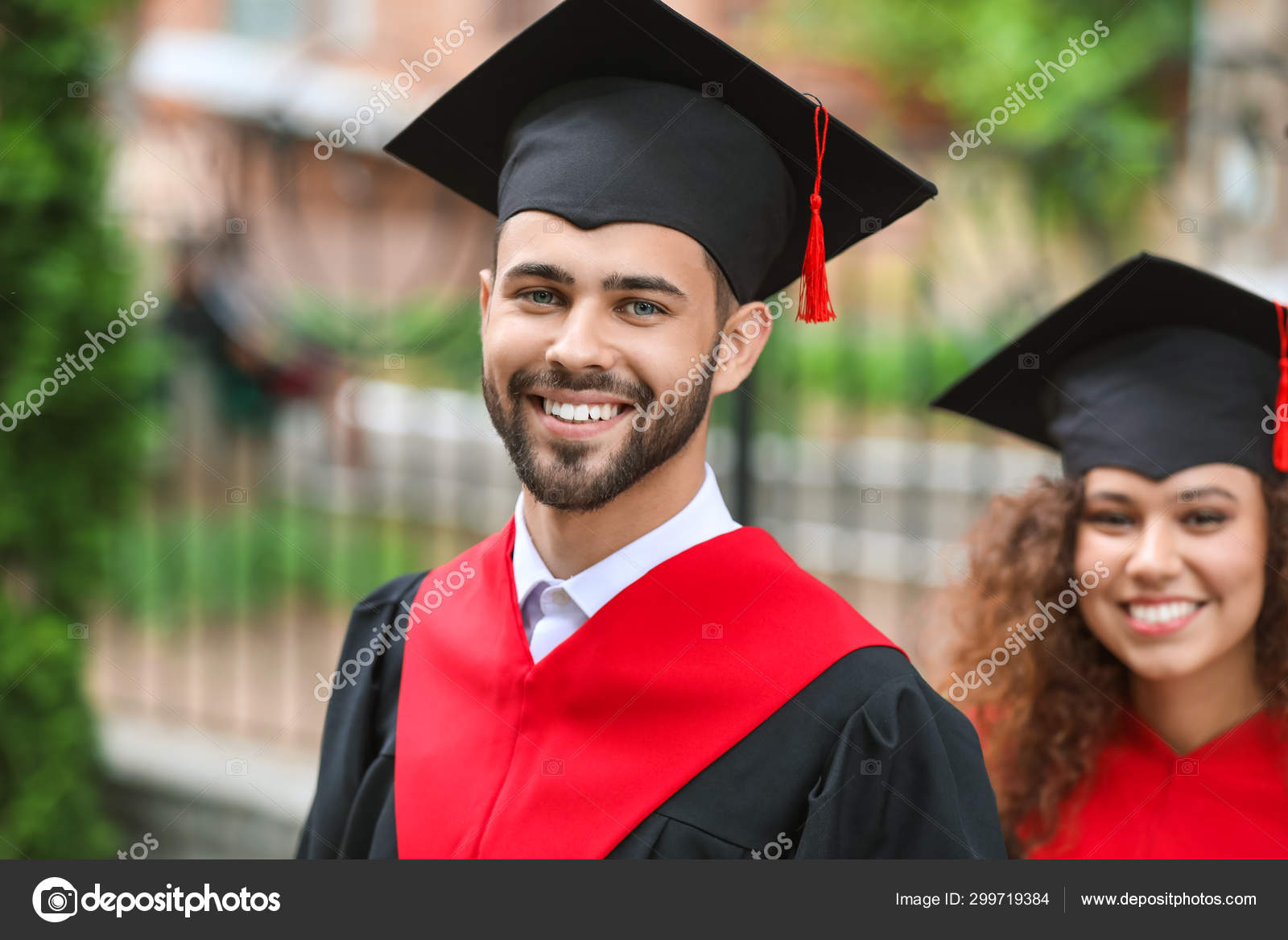 Happy students in bachelor robes outdoors — Stock Photo © serezniy #299719384