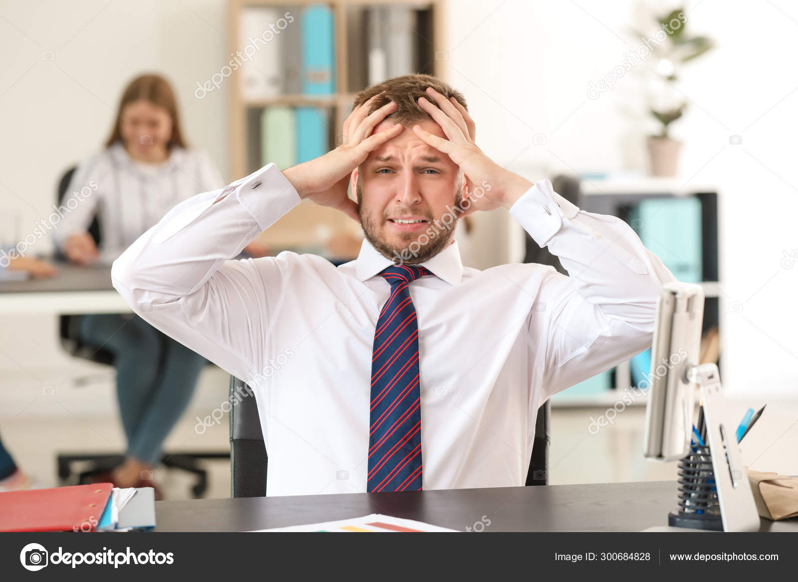 Businessman having panic attack in office Stock Photo by ©serezniy ...