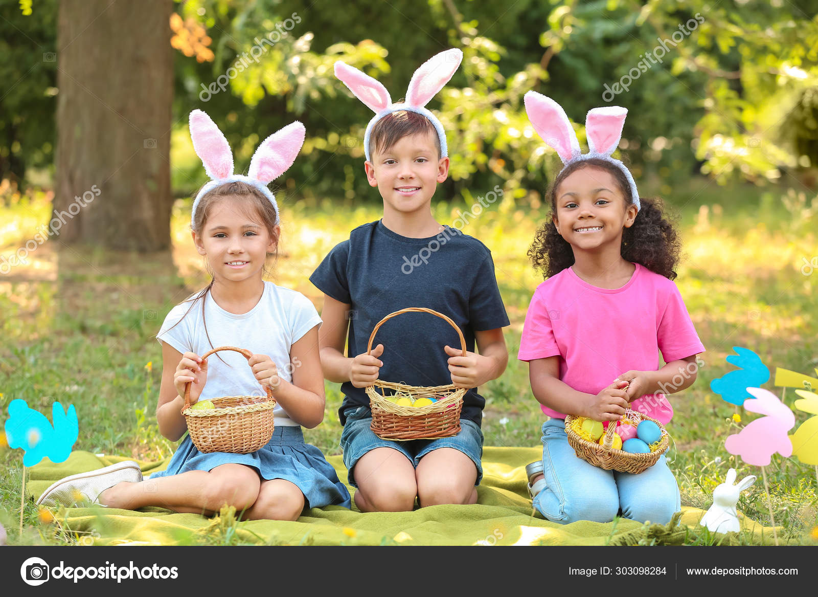 Little children gathering Easter eggs in park — Stock Photo © serezniy ...