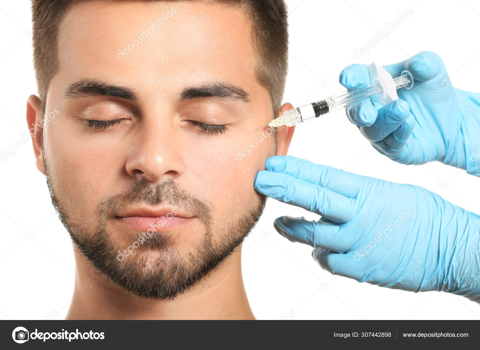 Handsome man receiving filler injection on white background Stock Photo ...