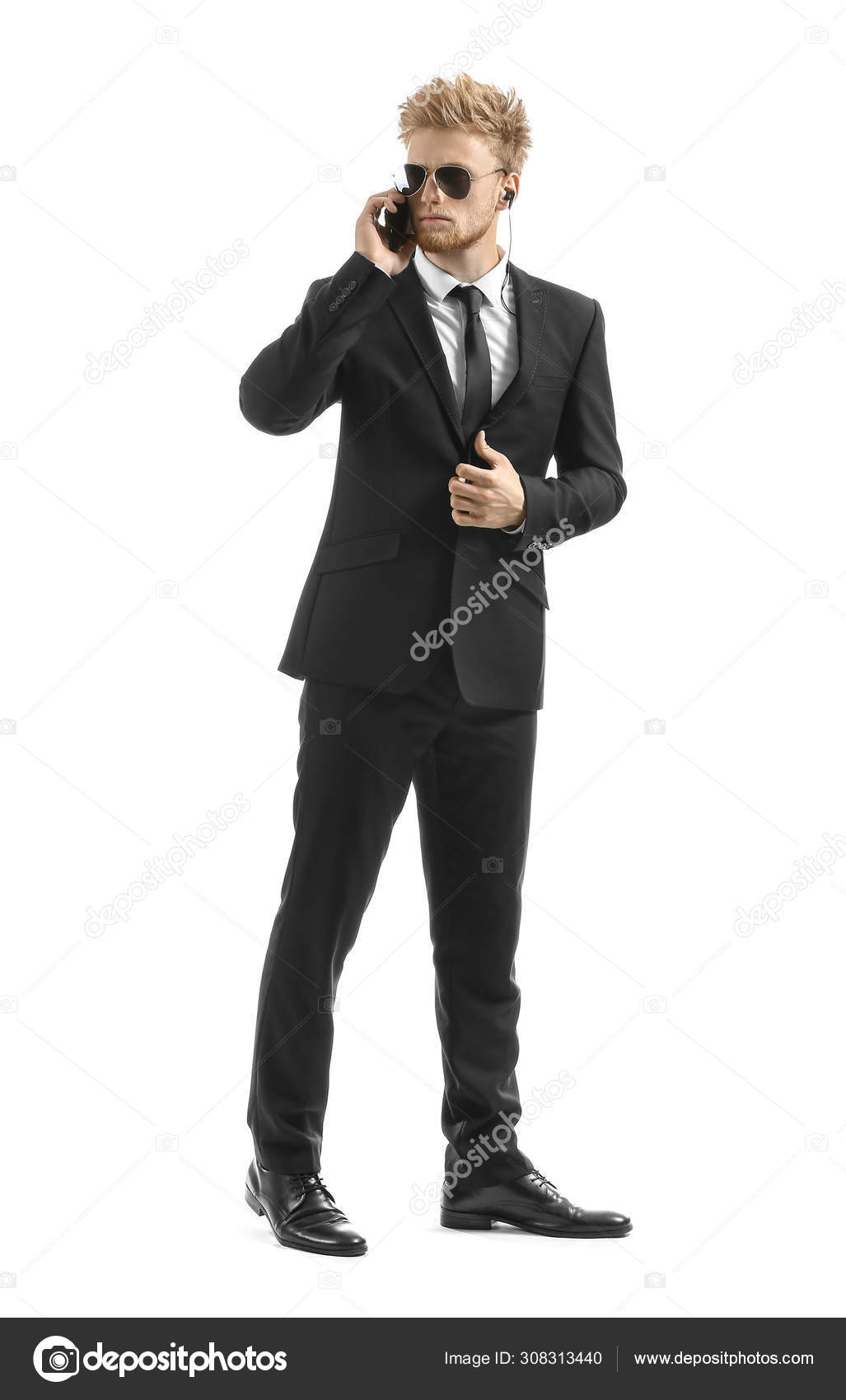 Handsome security guard talking by phone on white background Stock ...
