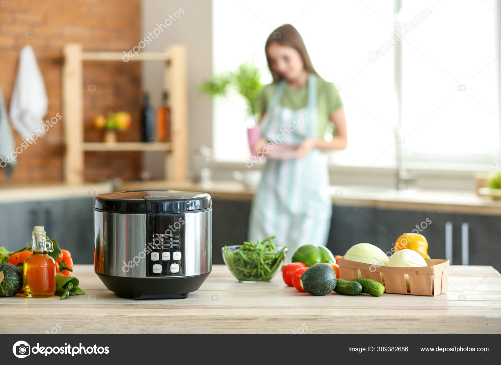 Modern multi cooker and products on kitchen table — Stock Photo ...
