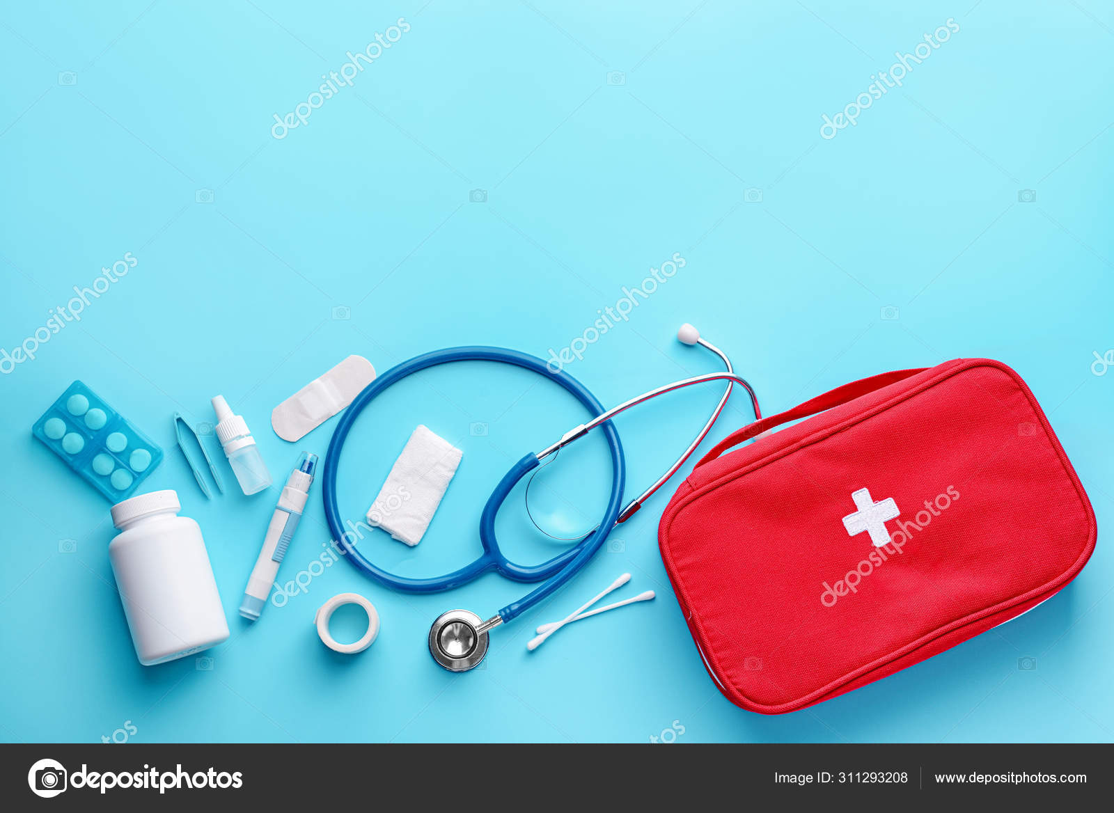 First aid kit on color background Stock Photo by ©serezniy 311293208