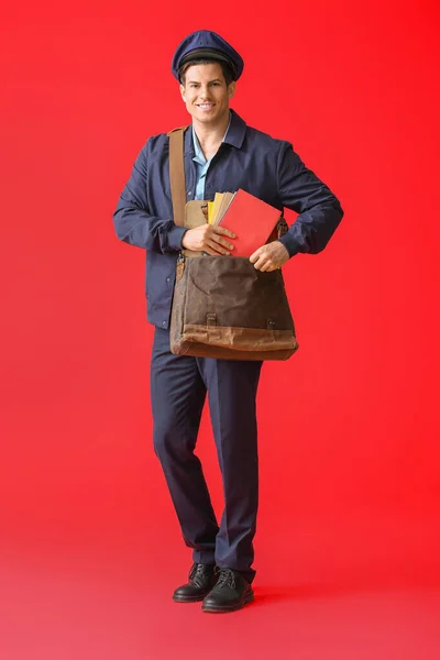 Handsome Young Postman Color Background Stock Photo by ©serezniy 378816834