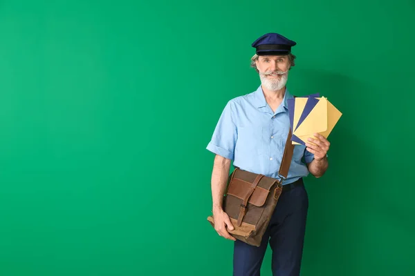 Handsome Young Postman Color Background Stock Photo by ©serezniy 378875910