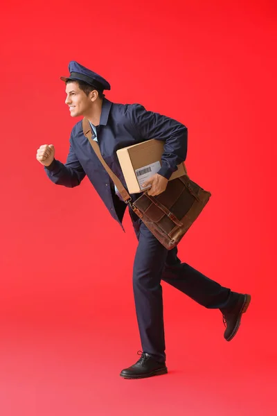 Handsome Young Postman Color Background Stock Photo by ©serezniy 378816834