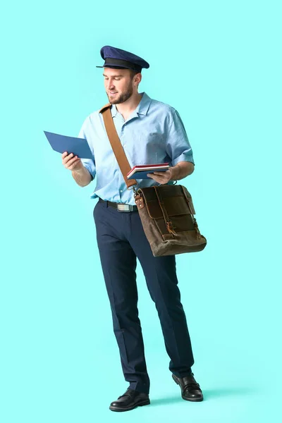 Handsome Young Postman Color Background Stock Photo by ©serezniy 378816834