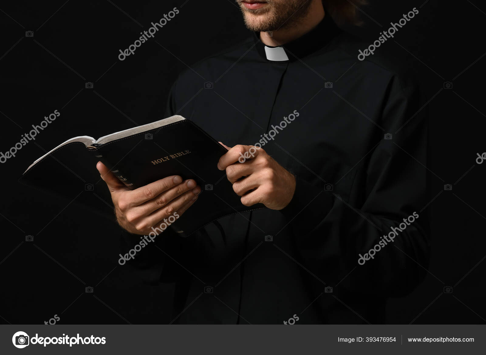 Handsome Priest Bible Dark Background Stock Photo by ©serezniy 393476954