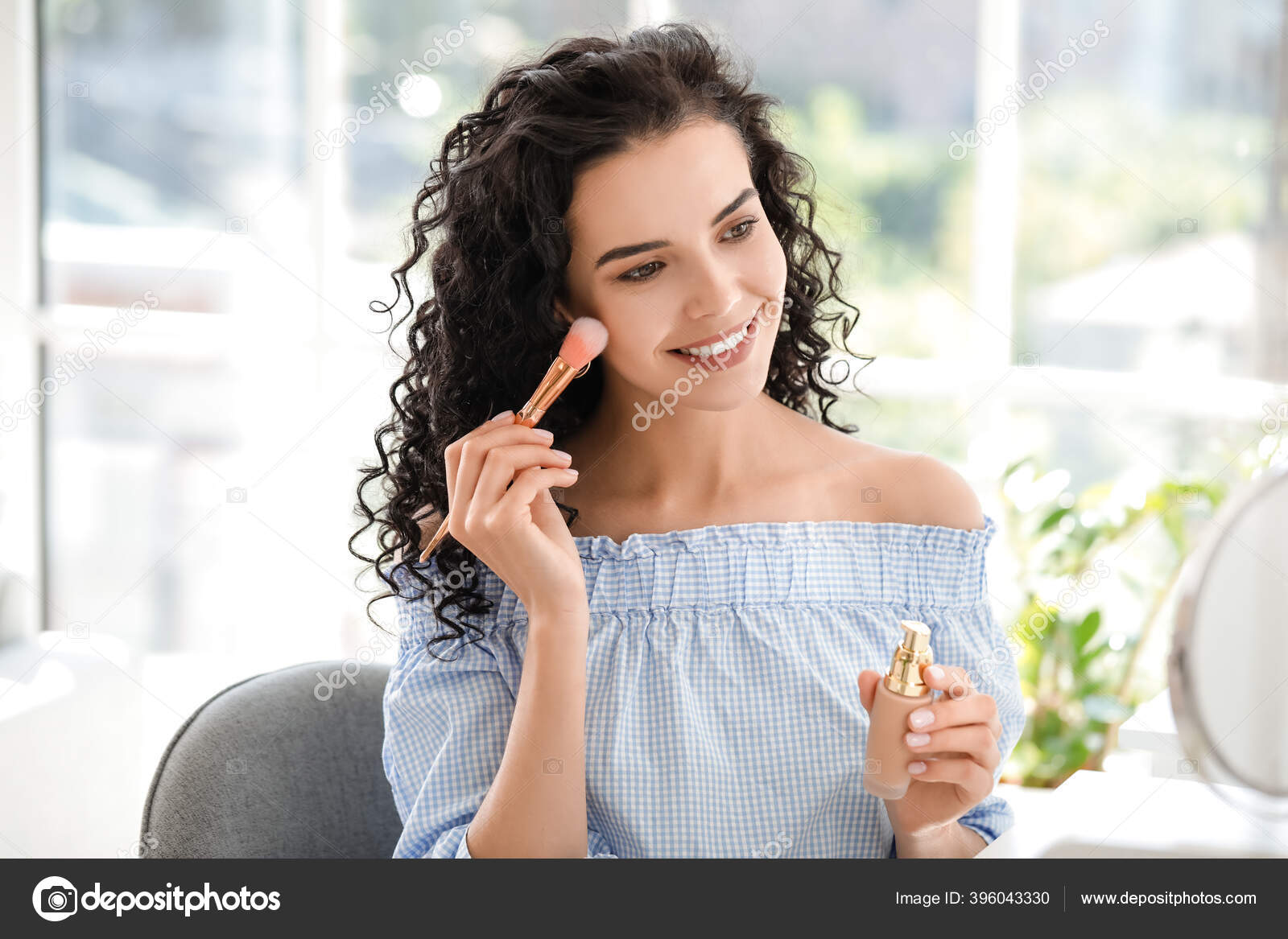 Beautiful Young Woman Applying Foundation Home Stock Photo by ©serezniy ...