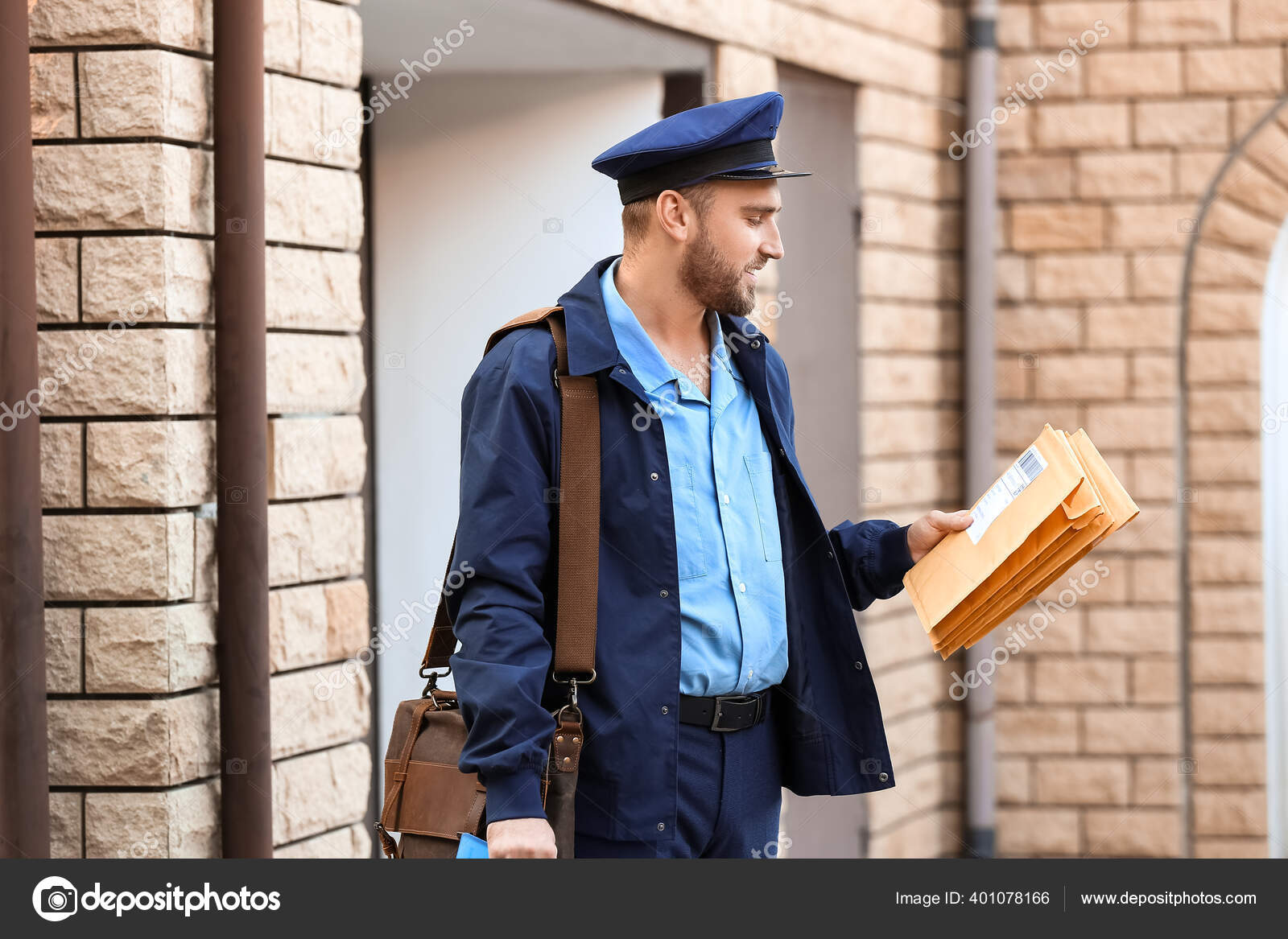 Handsome Young Postman Letters Outdoors Stock Photo by ©serezniy 401078166