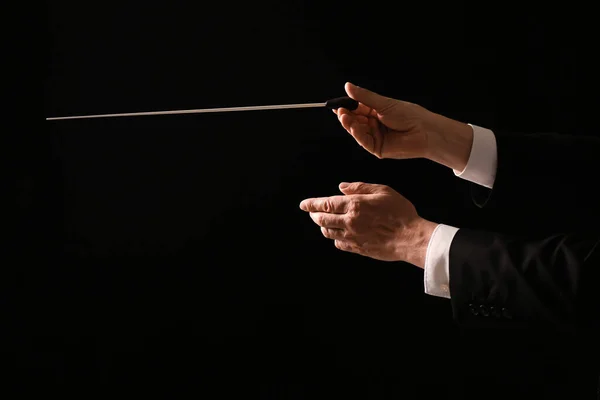 Senior Male Conductor Grey Background Stock Photo by ©serezniy 372456926