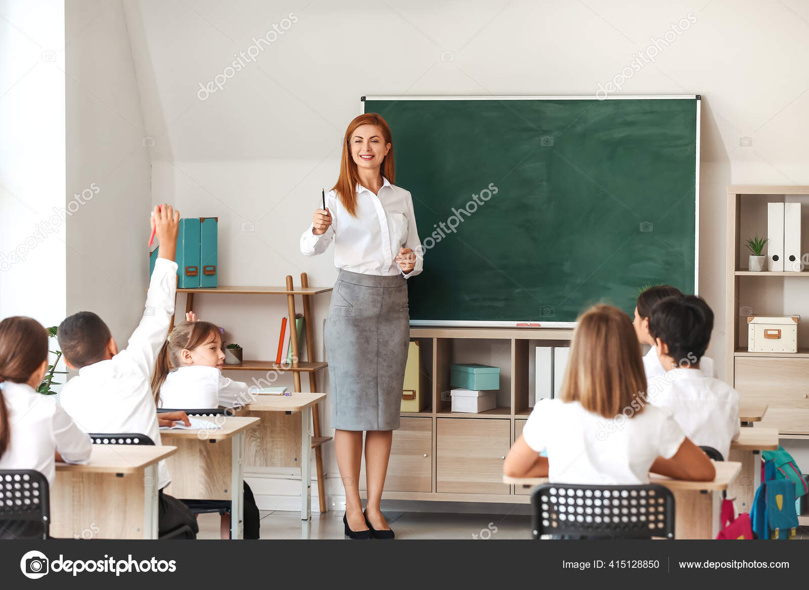 Teacher Conducting Lesson Classroom Stock Photo by ©serezniy 415128850