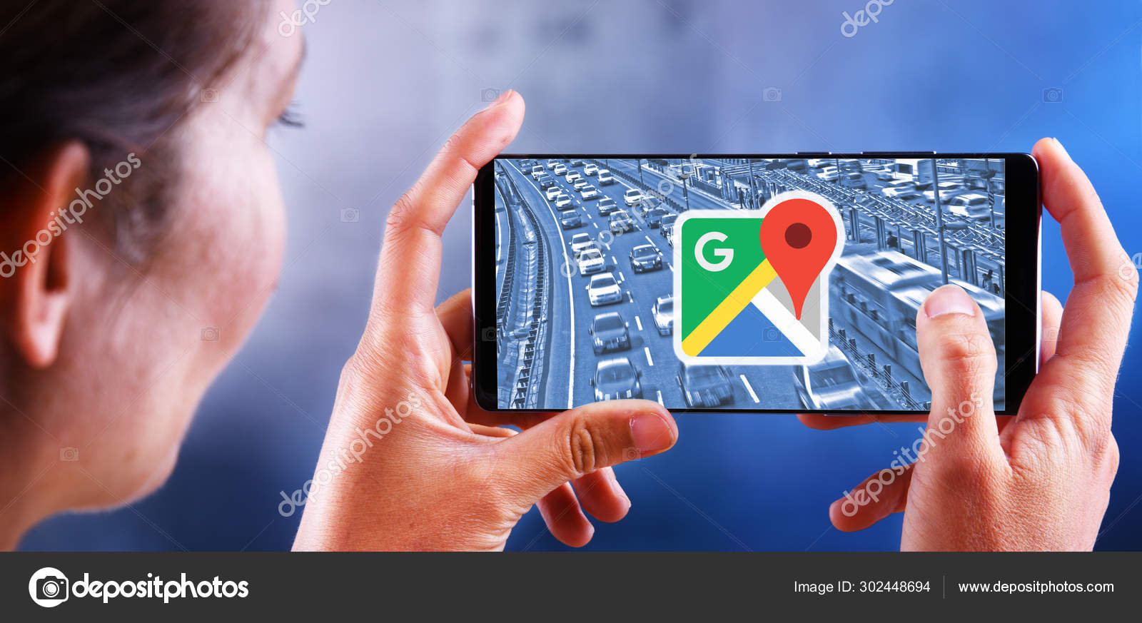 Woman holding smartphone displaying logo of Google Maps — Stock ...