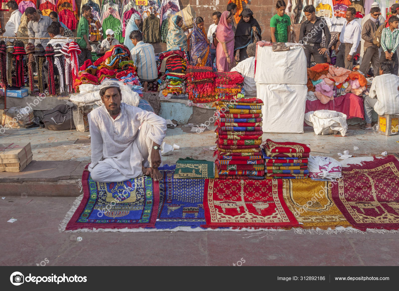 Muslim man sells carpets for praying at the central market Mee – Stock ...