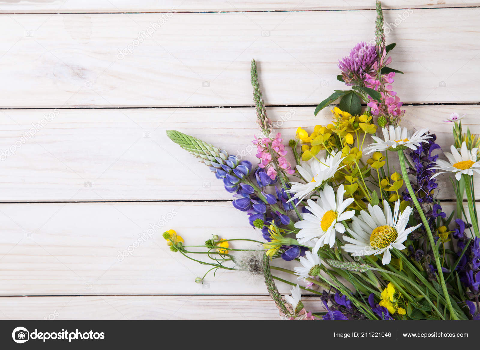 Top View Wild Flowers White Wooden Background Stock Photo by ©chepko ...