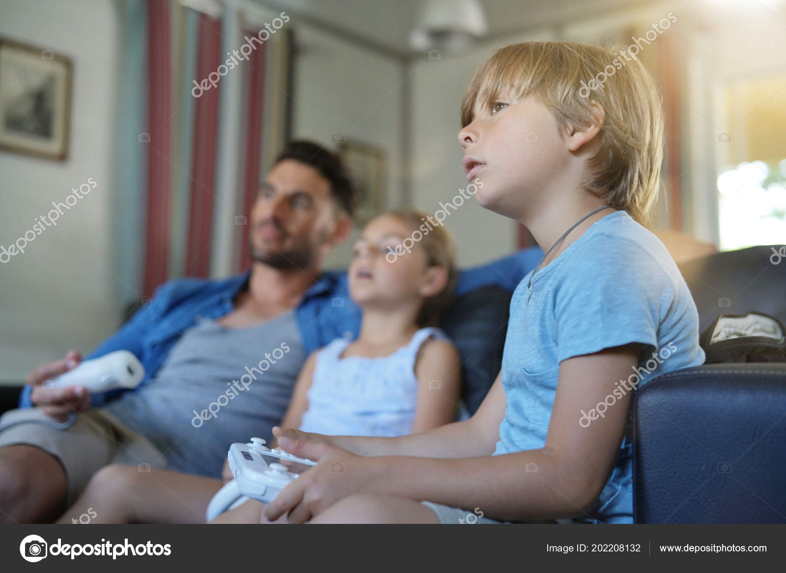 Daddy Kids Playing Video Game Home Stock Photo by ©Goodluz 202208132