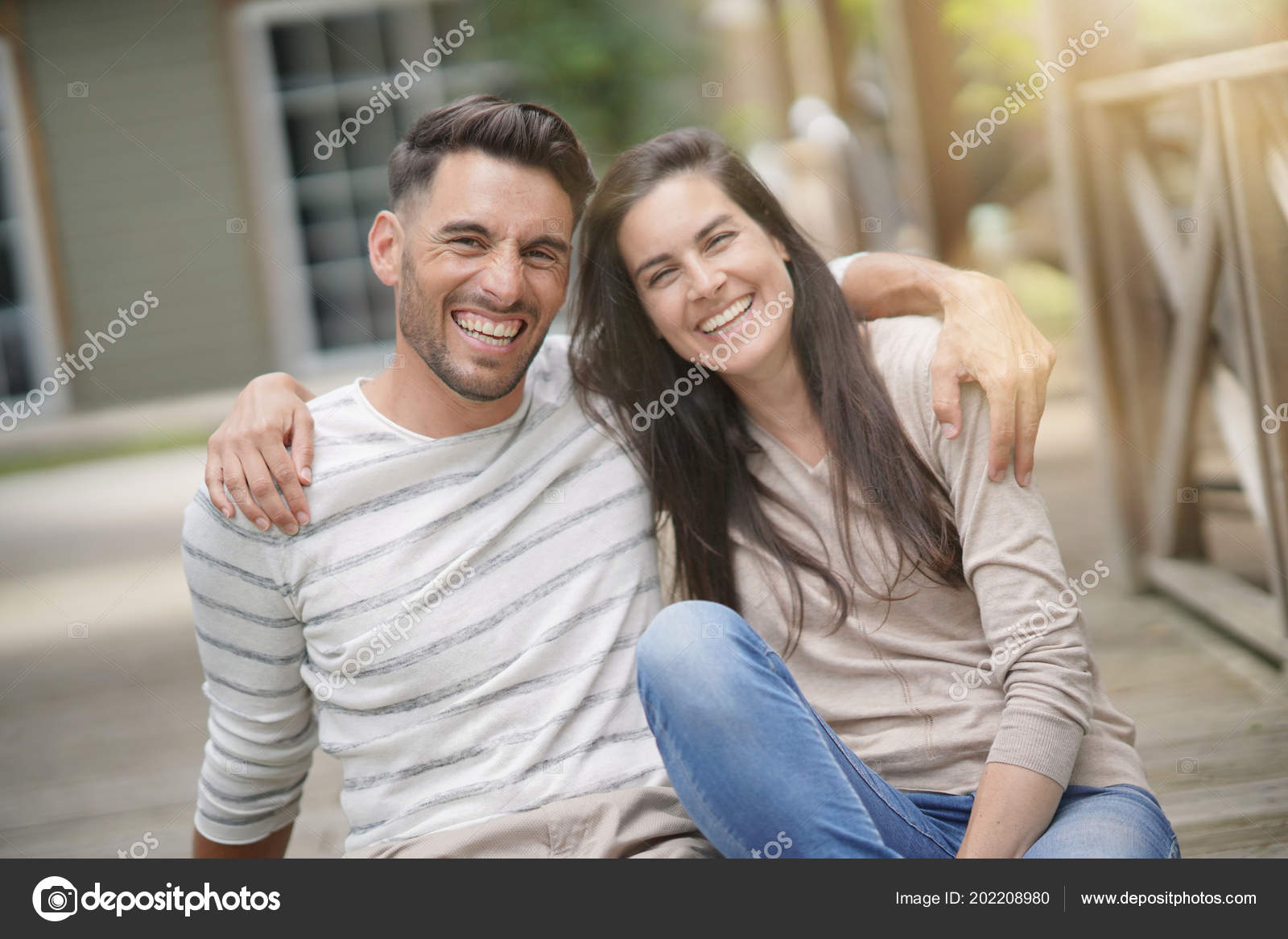Couple Relaxing Yard Embracing Each Other — Stock Photo © Goodluz ...