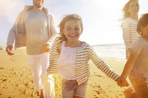 Family Running Sandy Beach Sunset Stock Photo by ©Goodluz 202216460
