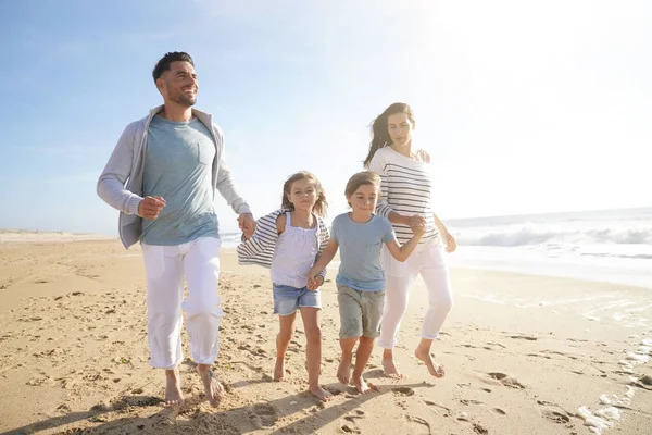 Family Running Sandy Beach Sunset Stock Photo by ©Goodluz 202216460