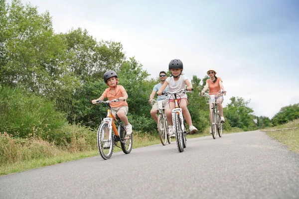 Kids Parent Riding Bikes Countryside Stock Photo by ©Goodluz 202214586