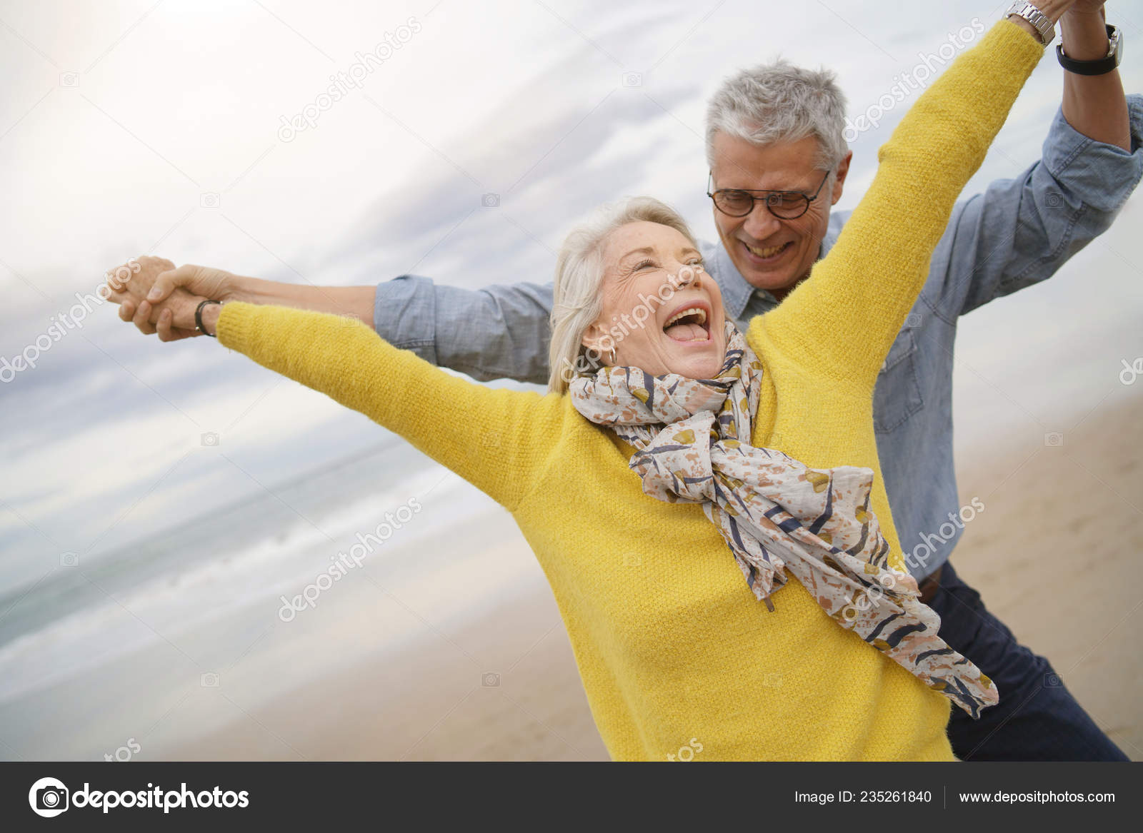 Lively Senior Couple Playing Beach Together — Stock Photo © Goodluz ...
